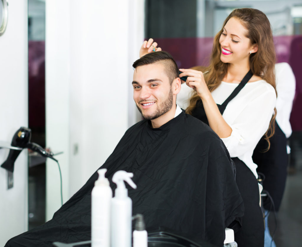 Hairdresser doing hairstyle - Meridian College